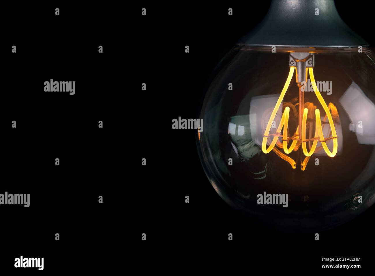 retro vintage light bulb with led technology built-in on warm light ...