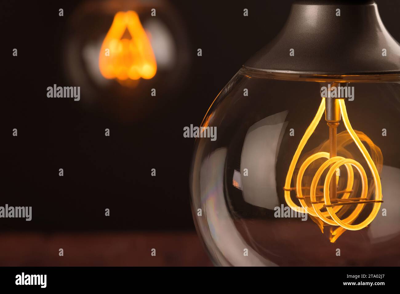 retro vintage light bulb with led technology built-in on warm light ...