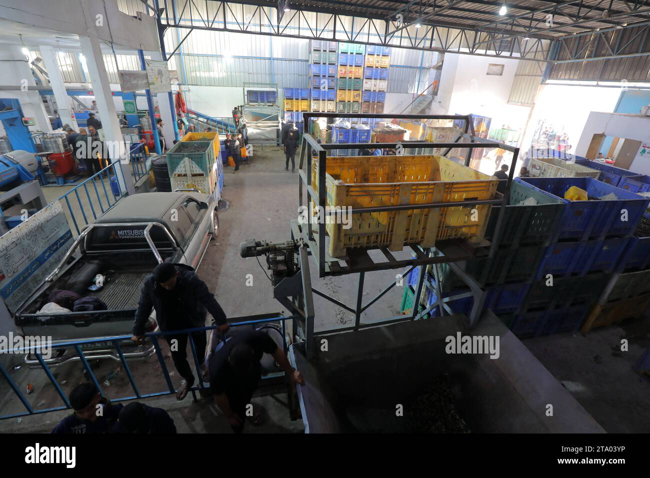 Palestinians make oil with freshly-harvested olives in Zawaida, in the ...