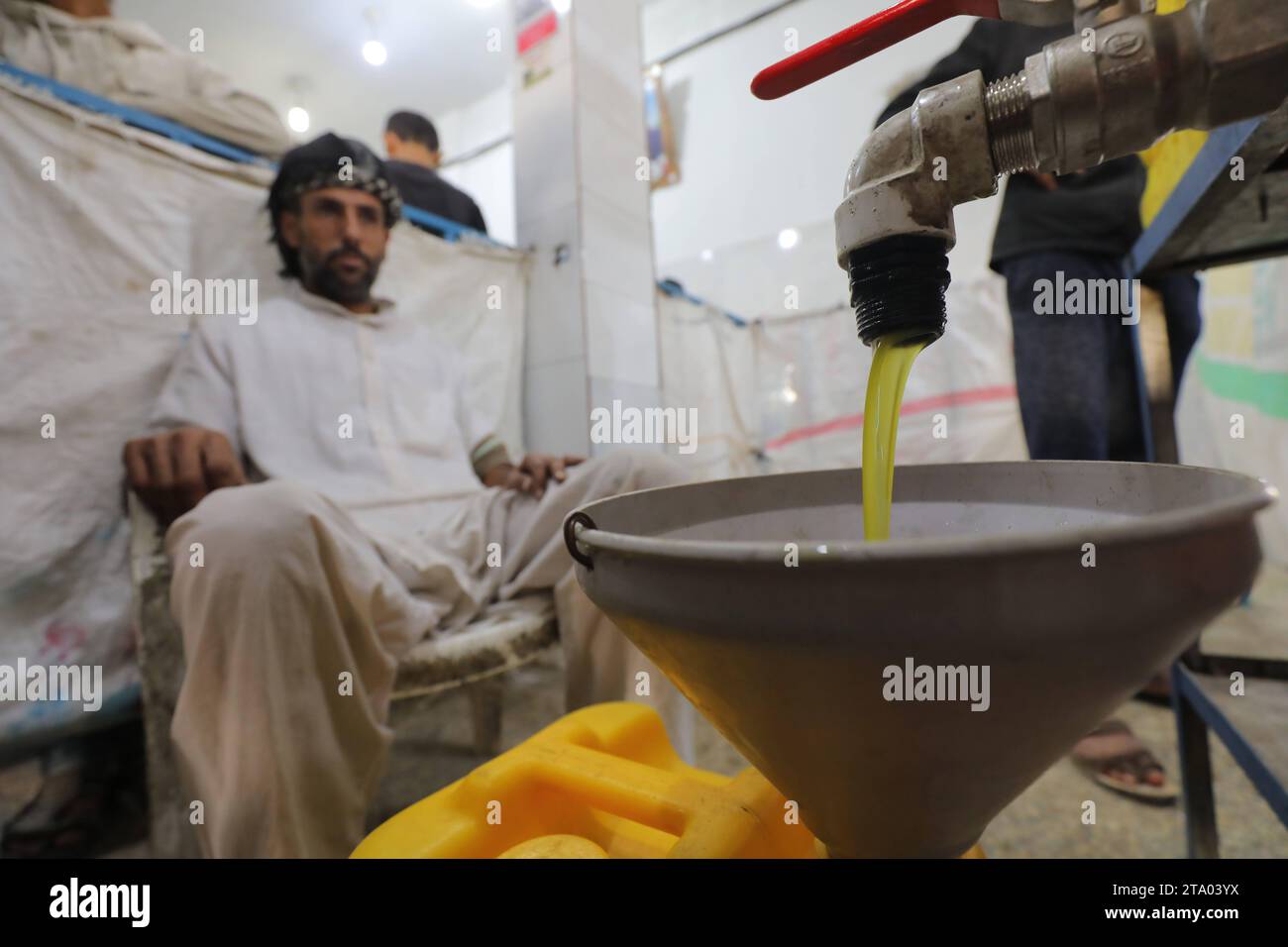 Palestinians make oil with freshly-harvested olives in Zawaida, in the ...