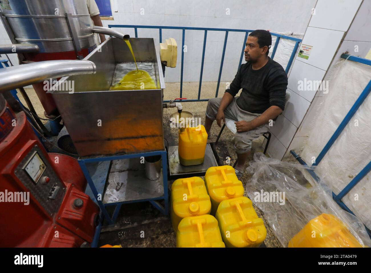 Palestinians make oil with freshly-harvested olives in Zawaida, in the ...