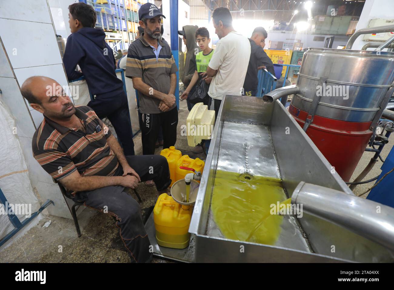 Palestinians make oil with freshly-harvested olives in Zawaida, in the ...