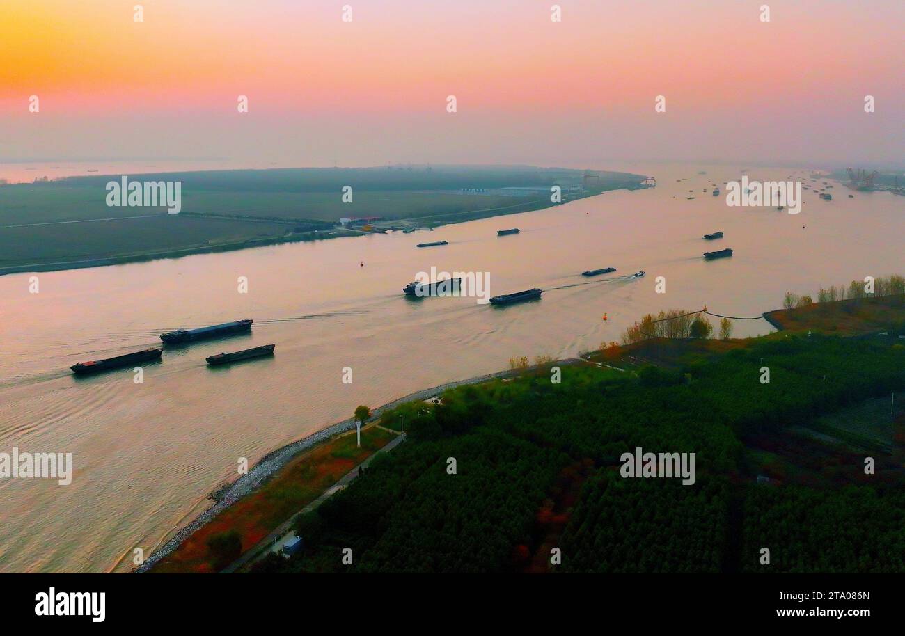 RUGAO, CHINA - NOVEMBER 28, 2023 - Transport ships travel under the ...