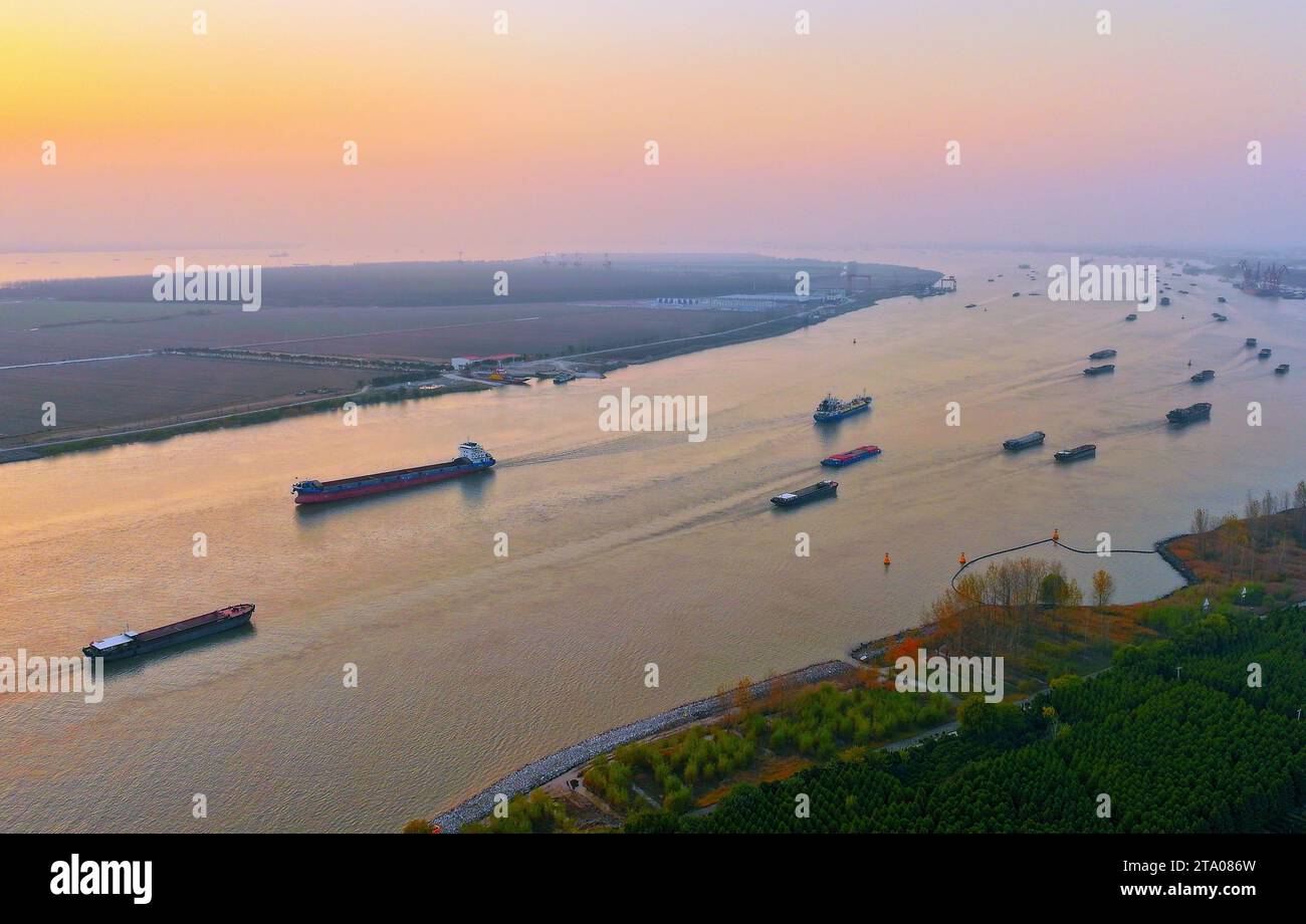 RUGAO, CHINA - NOVEMBER 28, 2023 - Transport ships travel under the ...