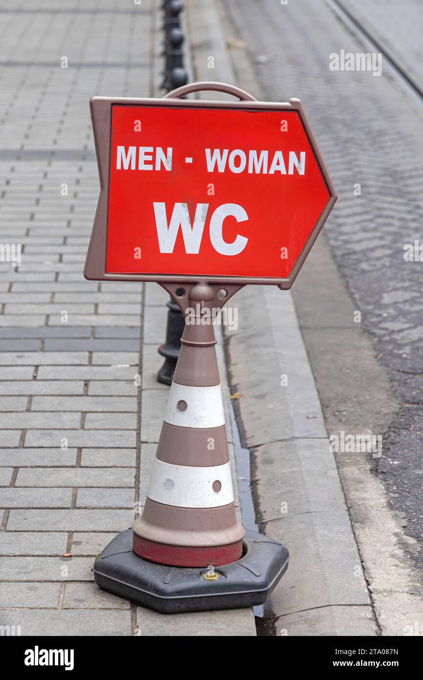 Direction Arrow Men Woman WC Sign Traffic Cone at City Street Stock ...