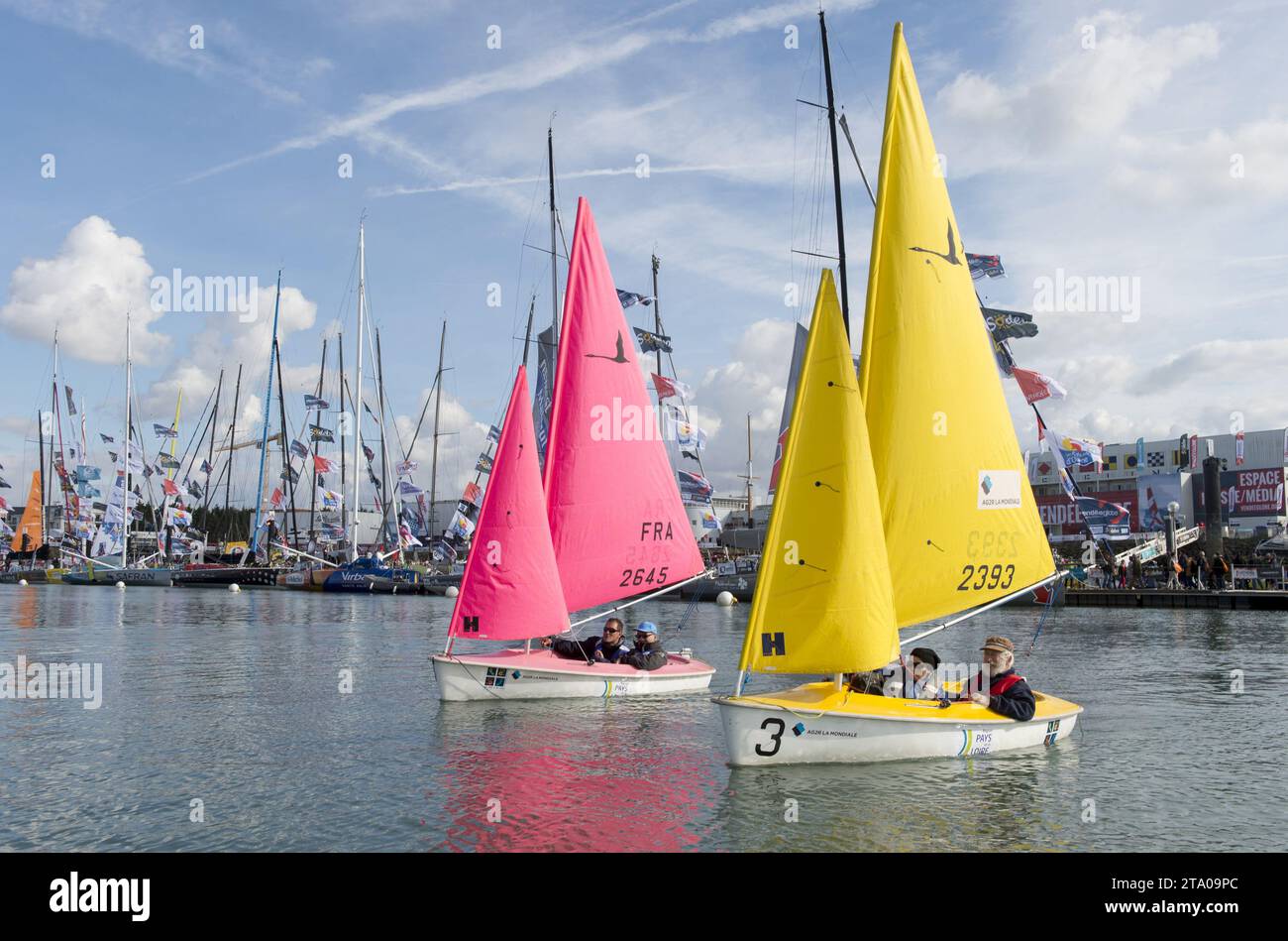 Small boats on water around pontoons during prestart of the Vendee ...