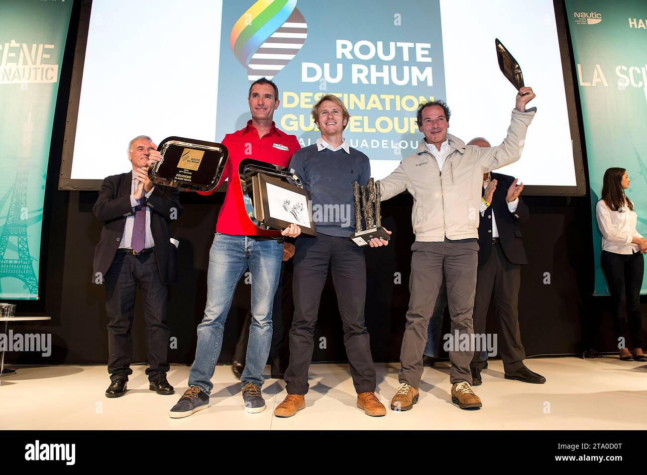 Class IMOCA podium with Jeremie Beyou (2nd), Francois Gabart(1st) and ...