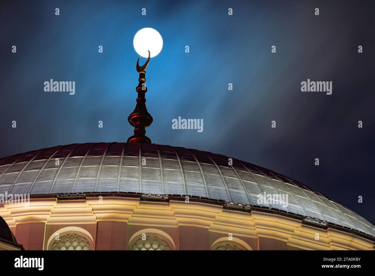 Islamic background photo. Full moon touches of the finial of a mosque's ...