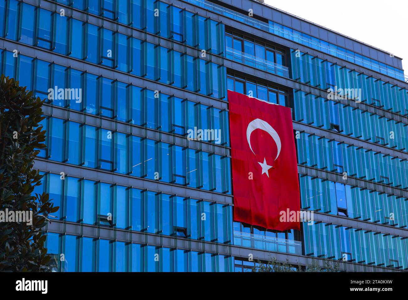 A turkish flag hanging on the modern building. Turkish Economy or ...