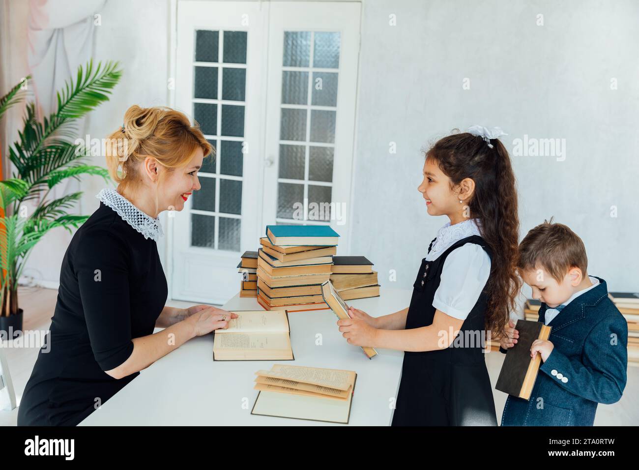 Children answer a question to a teacher at school Stock Photo - Alamy