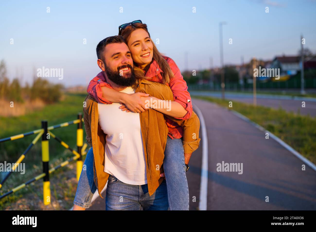 Woman carrying man on her back hi-res stock photography and images - Alamy
