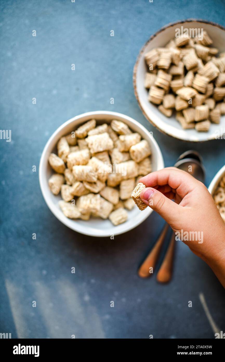 Set of various tasty breakfast cereals on light grey table, flat lay ...