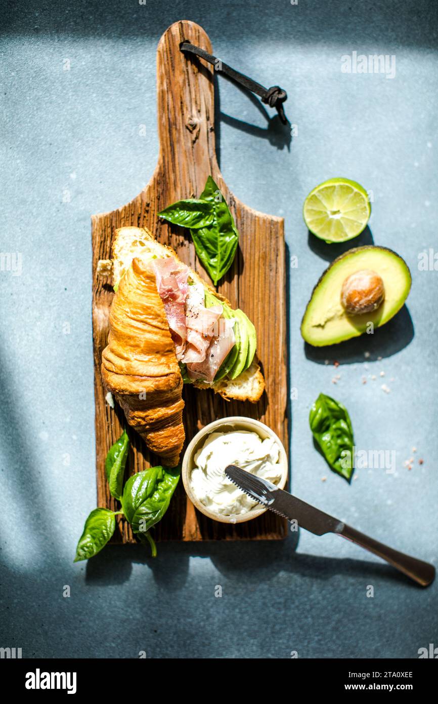 Croissant sandwiches with jamon ham serrano paleta iberica, avocado ...