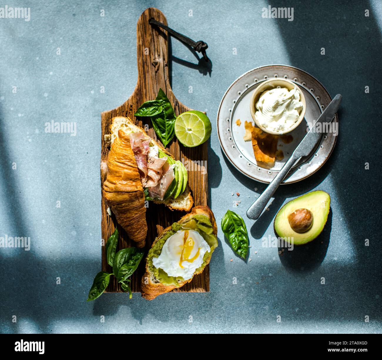 Croissant sandwiches with jamon ham serrano paleta iberica, avocado ...