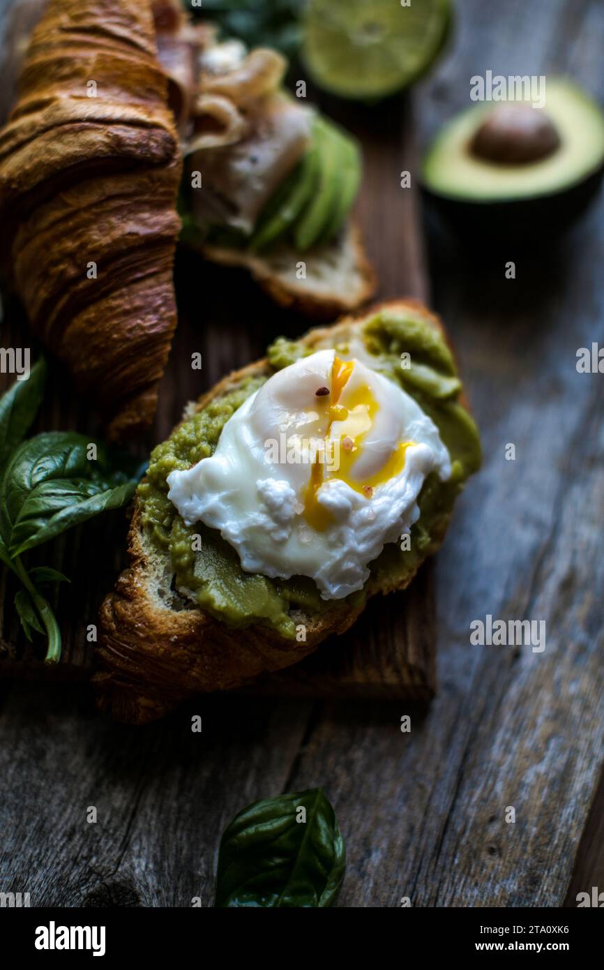Croissant sandwiches with jamon ham serrano paleta iberica, avocado ...