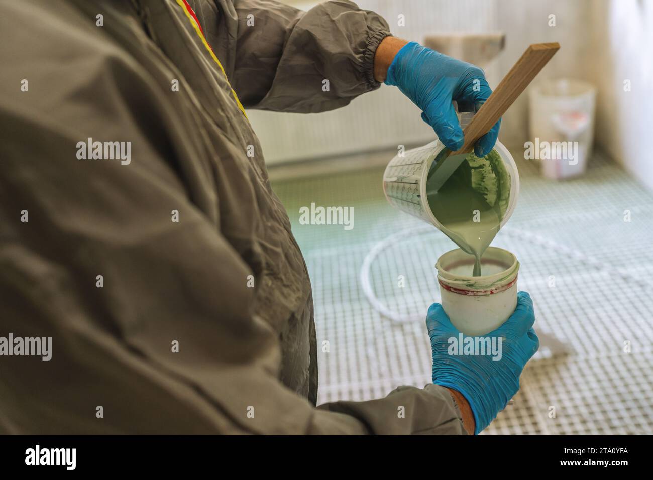 Person pouring paint hi-res stock photography and images - Alamy