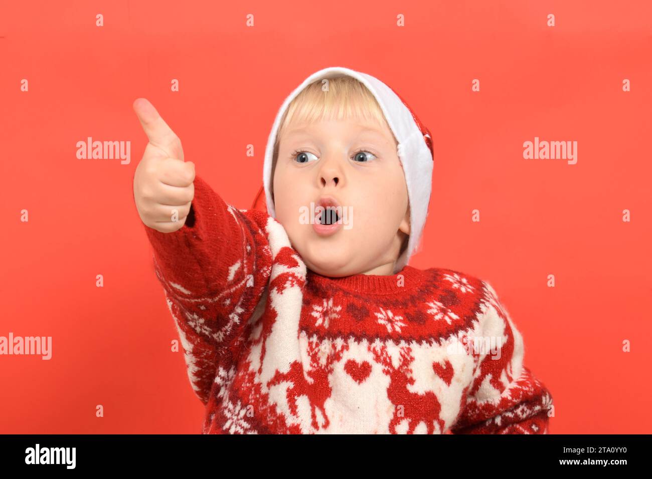 cute boy child pointing direction, Christmas Stock Photo - Alamy