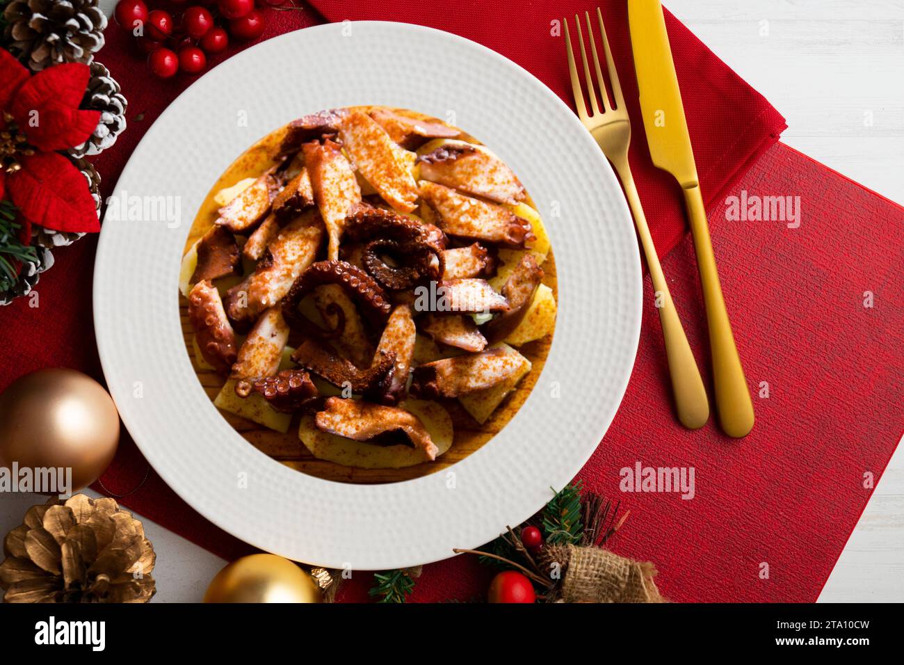 Pulpo a la Gallega. Octopus cooked with boiled potato, paprika and ...