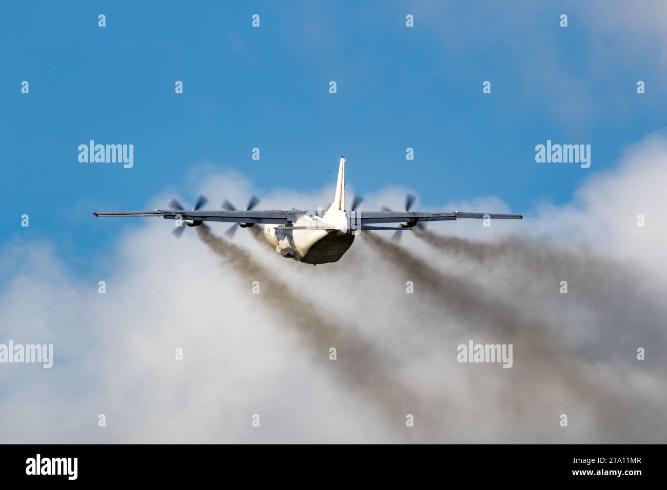 Old cargo airplane taking off with turboprop engine smoke emission ...