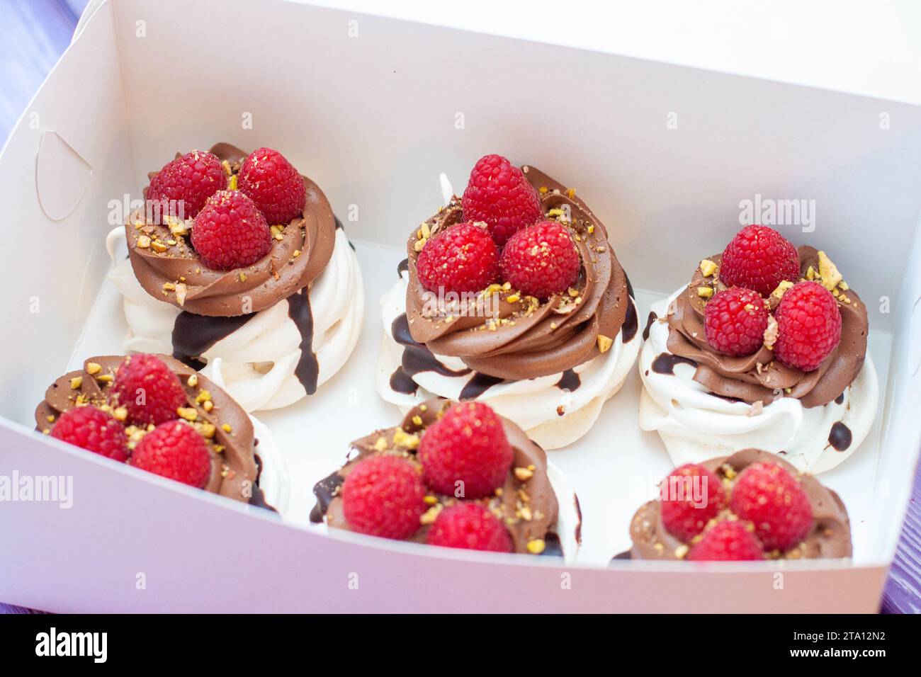 Mini cakes with whipped cream, chocolate, meringue and fresh ...