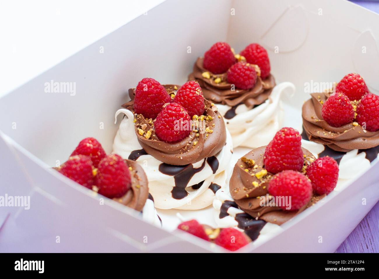 Mini cakes with whipped cream, chocolate, meringue and fresh ...