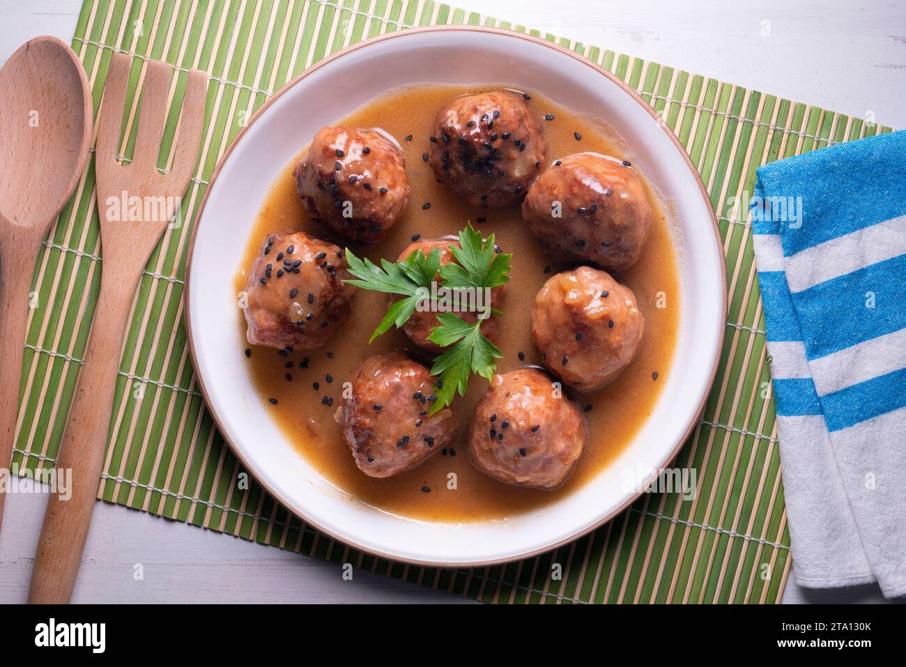 Meat meatballs with tomato sauce and vegetables. Traditional Spanish ...