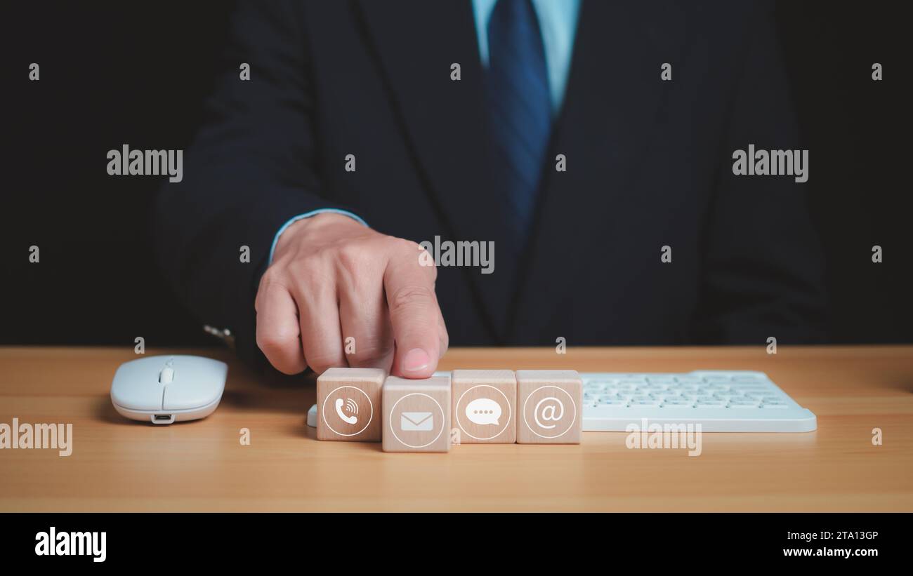 Customer support hotline, contact us, businessman sitting at work and ...