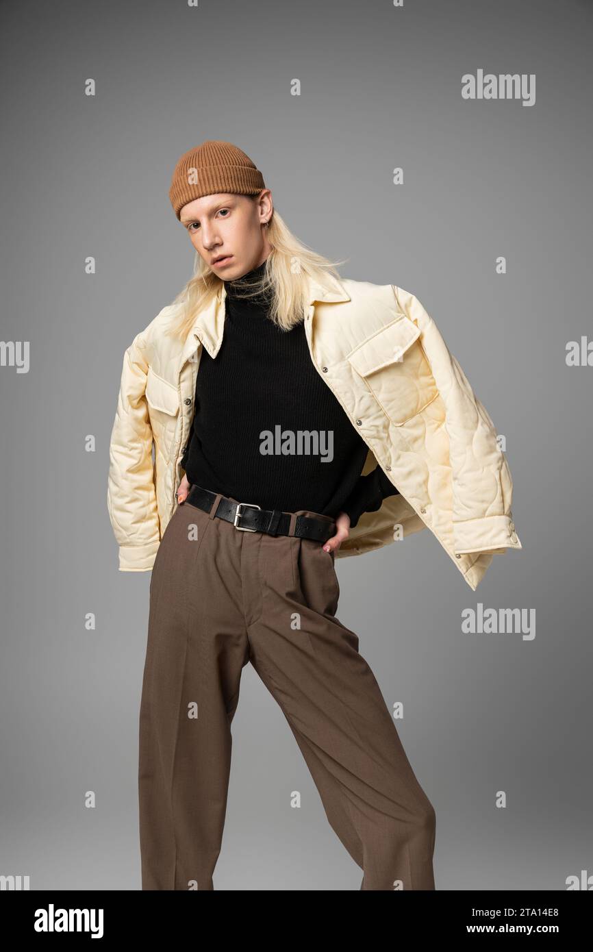 appealing handsome androgynous person in beanie hat and winter jacket ...