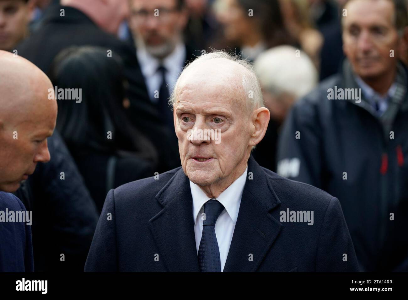 Irish business man Larry Goodman speaks with mourners following the ...