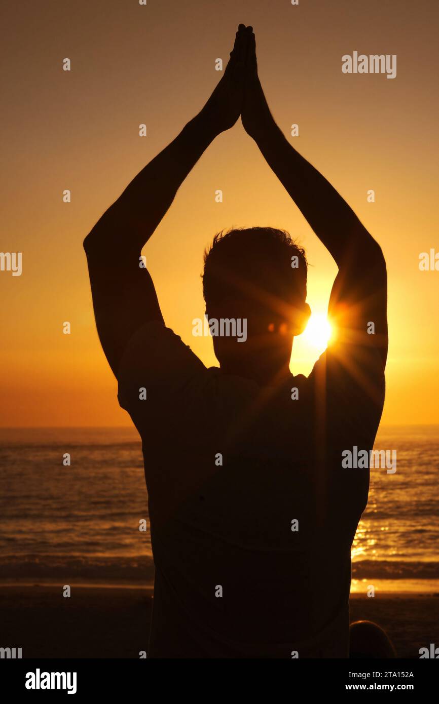 Silhouette, man and praying with hands for yoga, health and wellness on ...