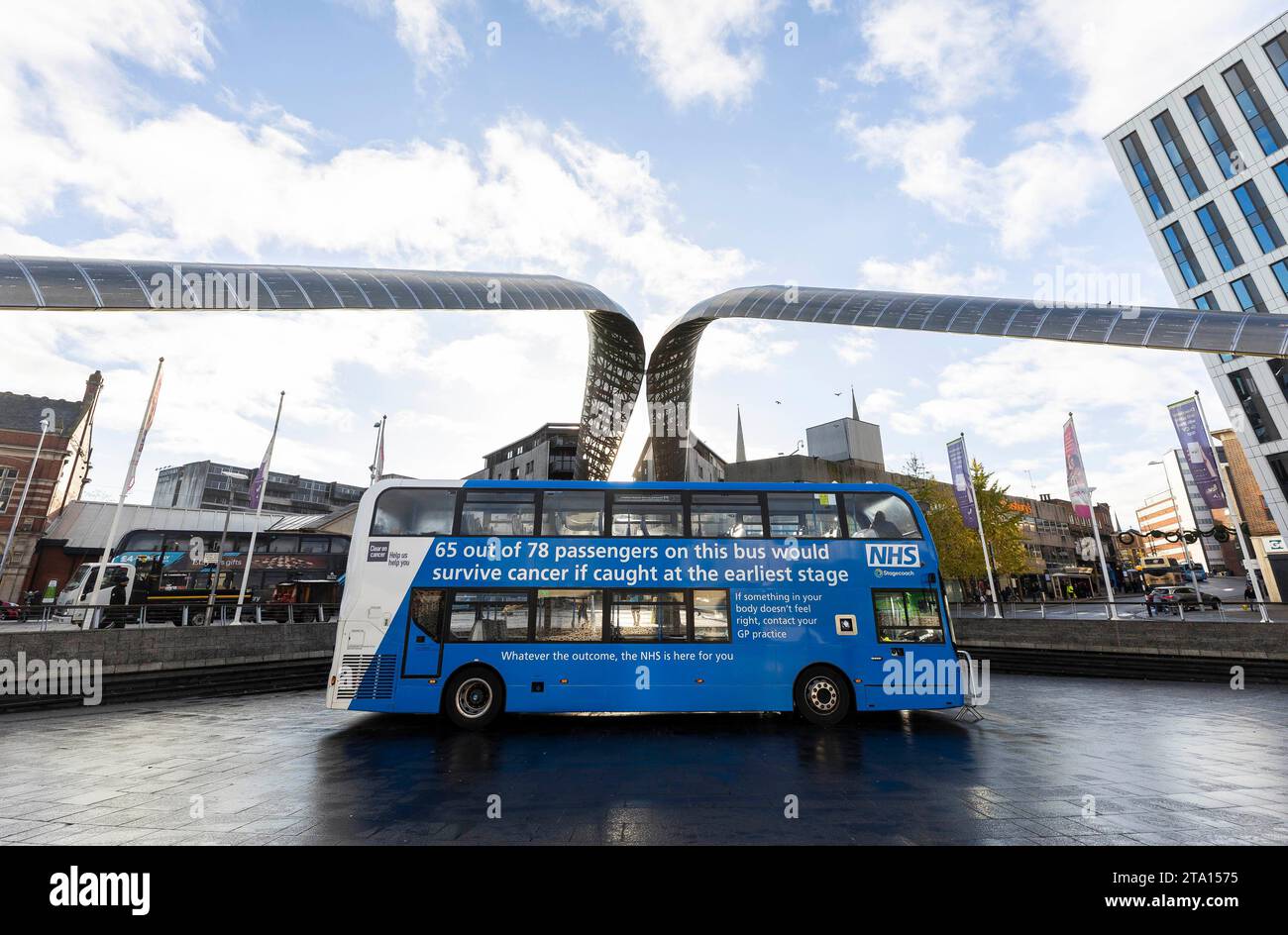 EDITORIAL USE ONLY The 'NHS Bus-ting Cancer' bus passes through ...