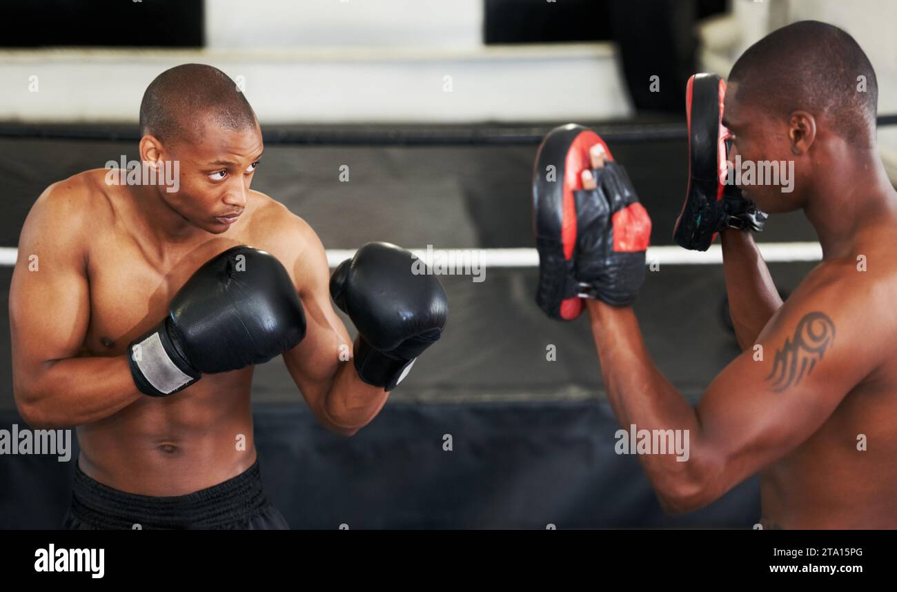 Boxing, coaching and black man with personal trainer for fitness, power ...