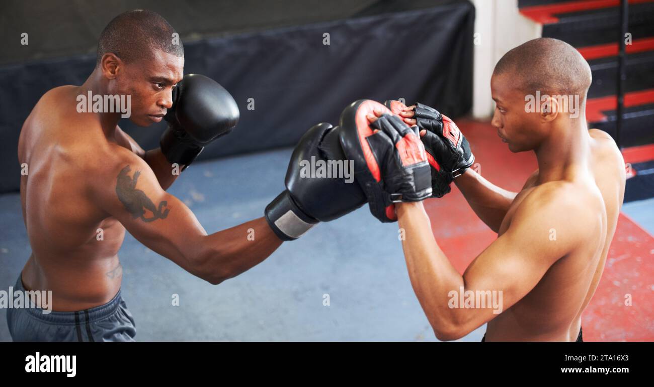 Boxing, coaching and black man with personal trainer for support, power ...