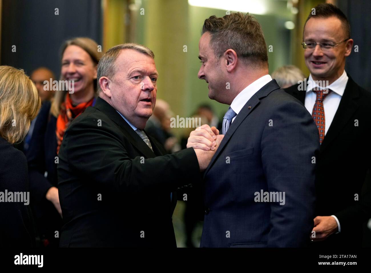 Denmark's Foreign Minister Lars Lokke Rasmussen, center left, shakes ...
