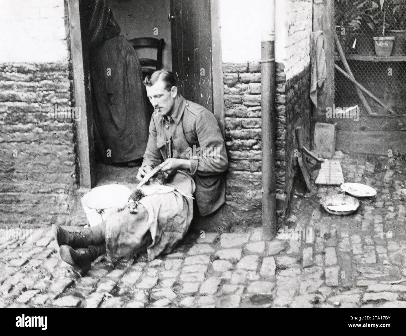 WW1 World War I - A British soldier prepares a pheasant for eating ...