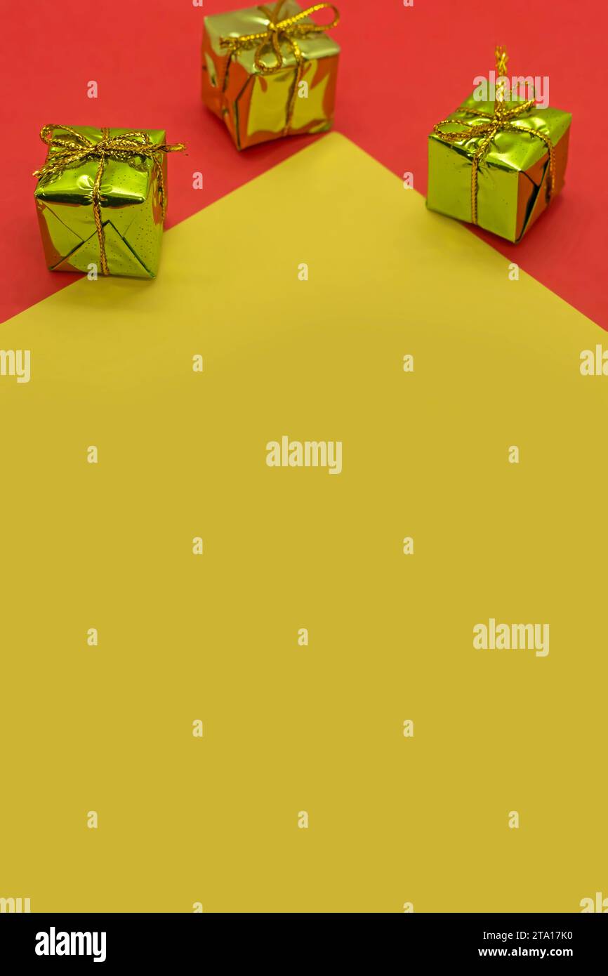 Gift boxes on a red and yellow background with space for text Stock ...