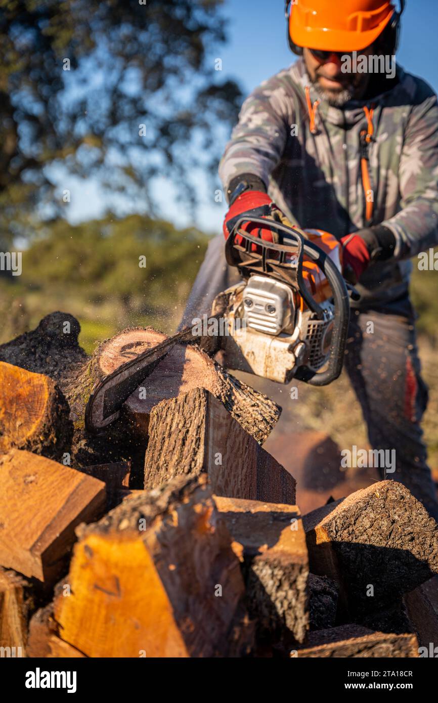 image of a man in front of the camera with a beard, orange helmet and ...
