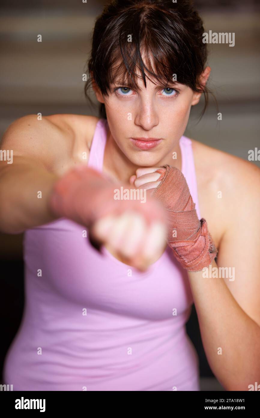 Boxing, punch and portrait of woman with fitness, power and fearless ...