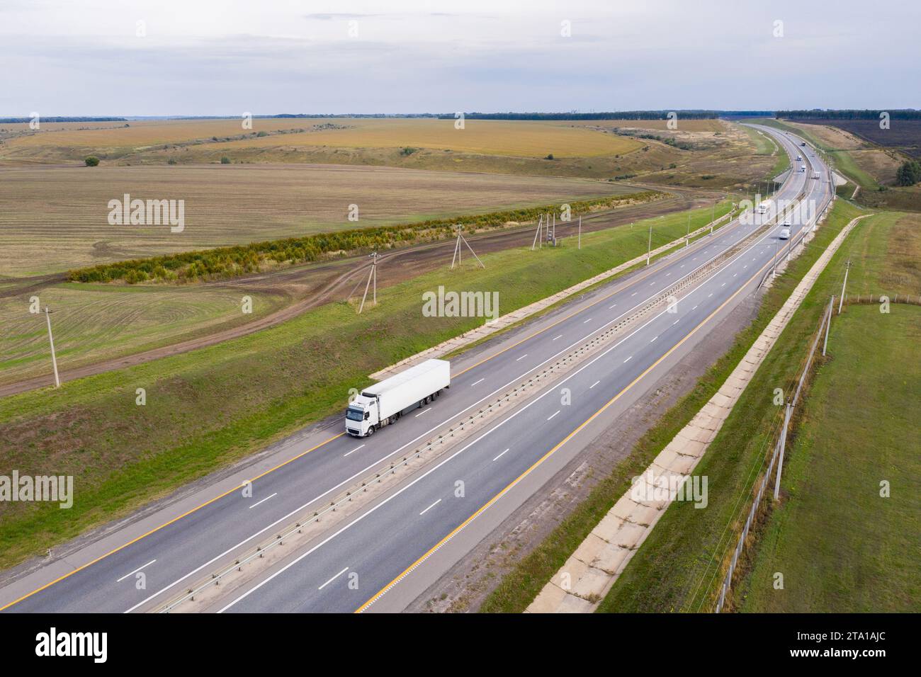 Trucks with trailers on the highway. Aerial view Stock Photo - Alamy