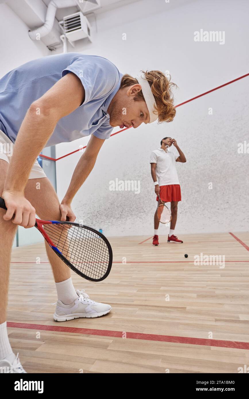 tired multicultural players in sportswear breathing heavily after ...