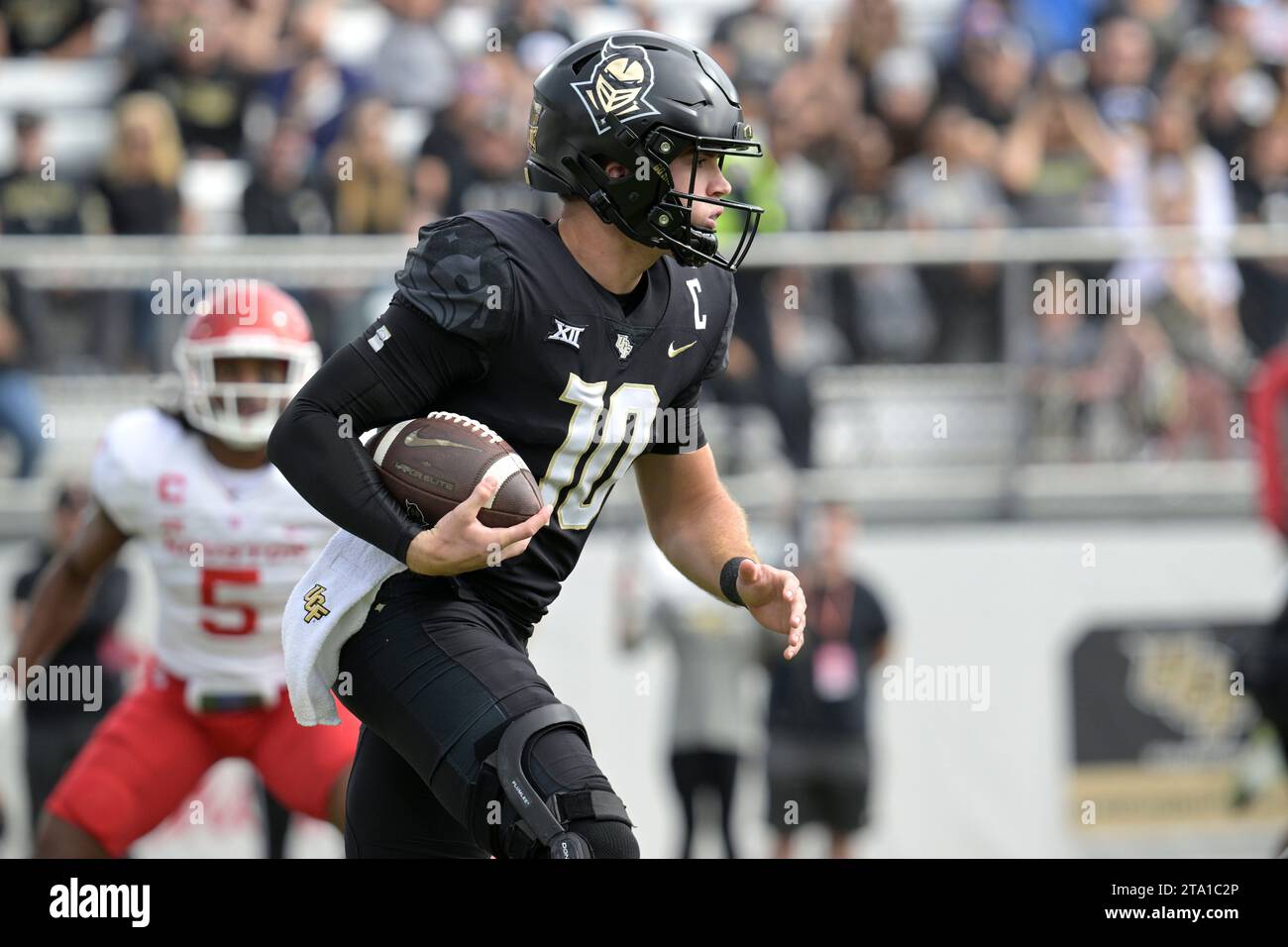 Central Florida quarterback John Rhys Plumlee (10) scrambles for ...