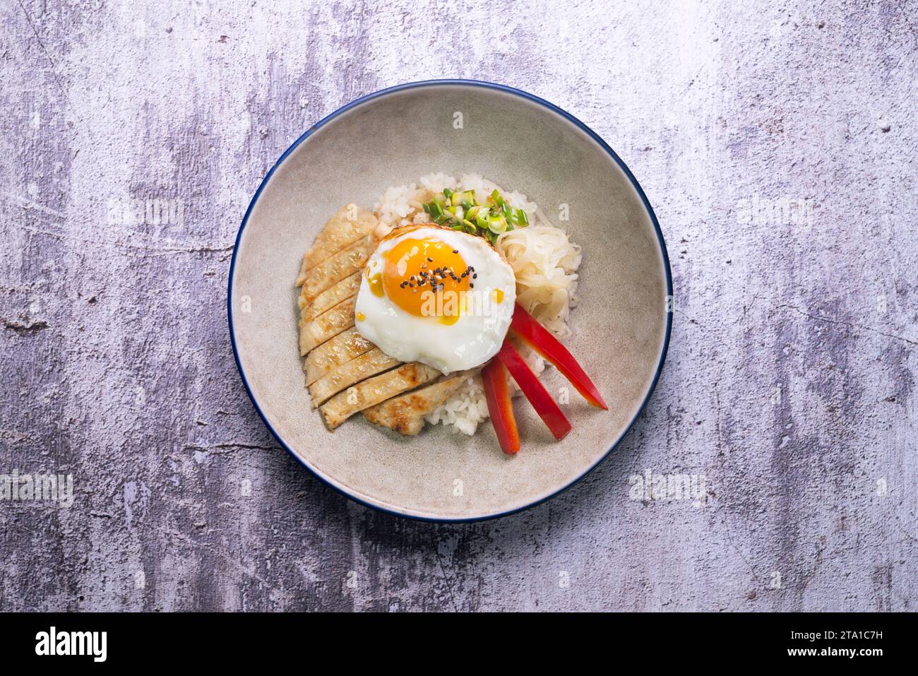 Teriyaki chicken donburi with fried egg Stock Photo - Alamy