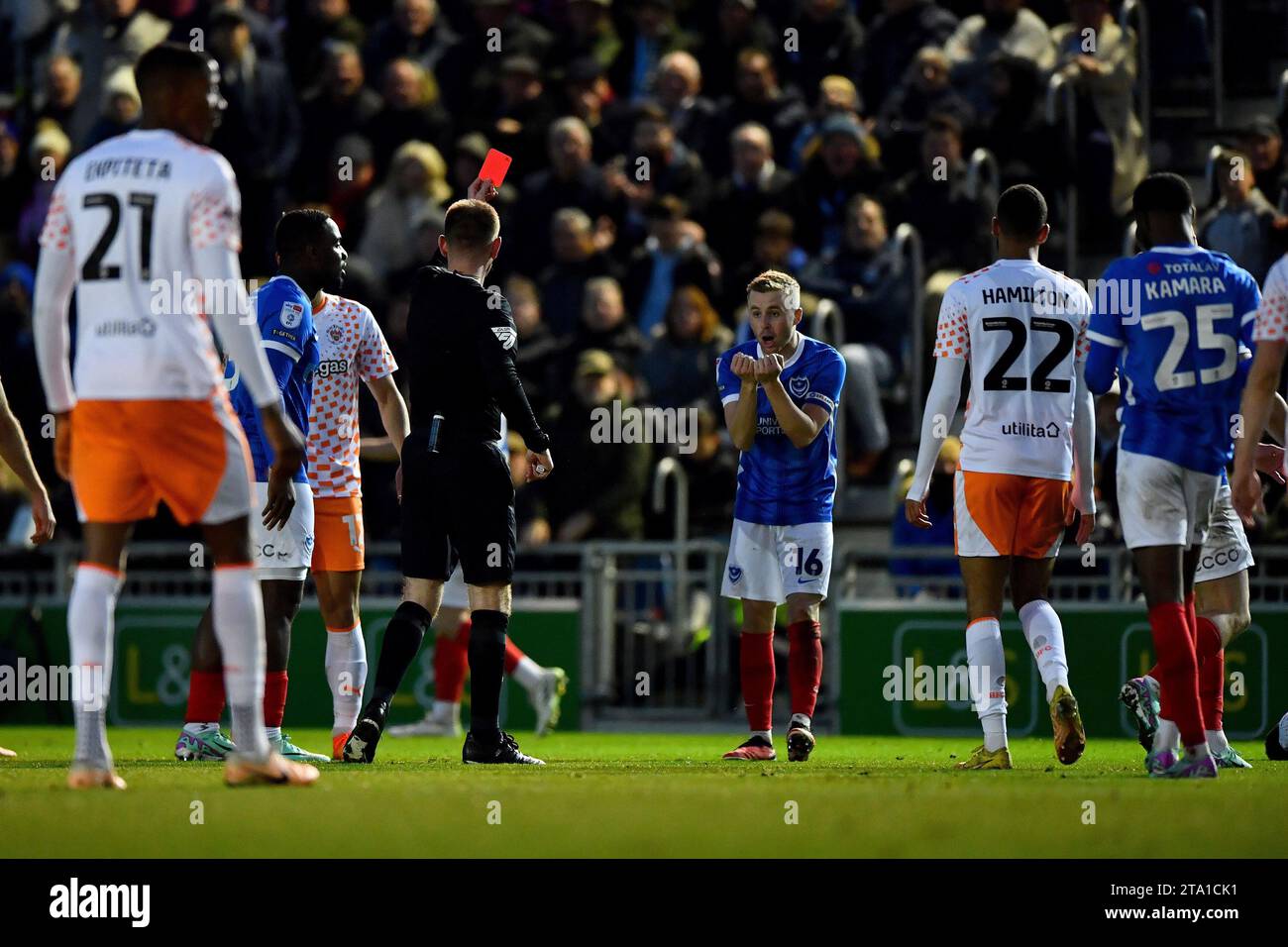 Joe Morrell of Portsmouth receives a second yellow and then a red card ...