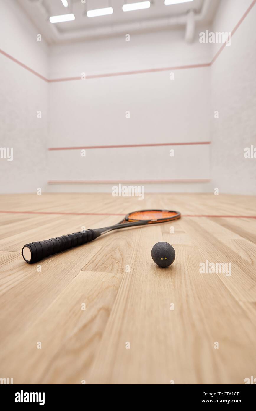 squash ball and racquet inside of court with white walls, motivation ...
