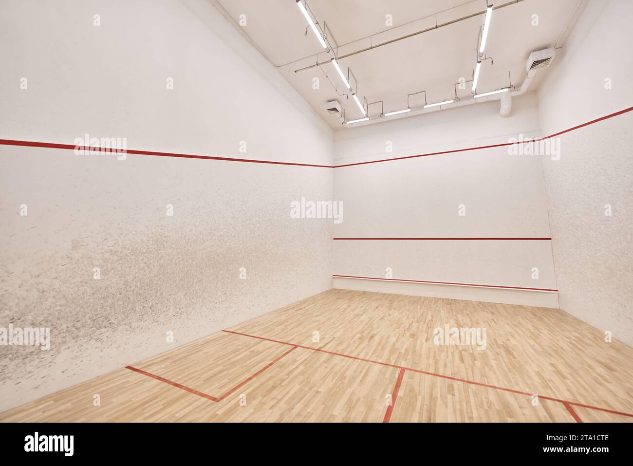 modern squash court with white walls and polished floor, motivation and ...