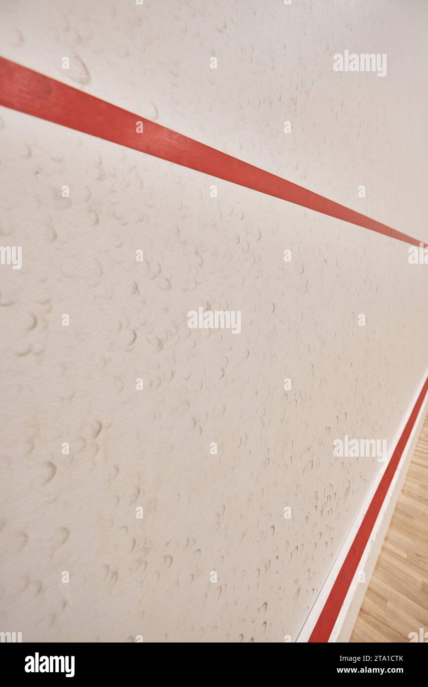 modern squash court room with white walls and red strip, motivation and ...