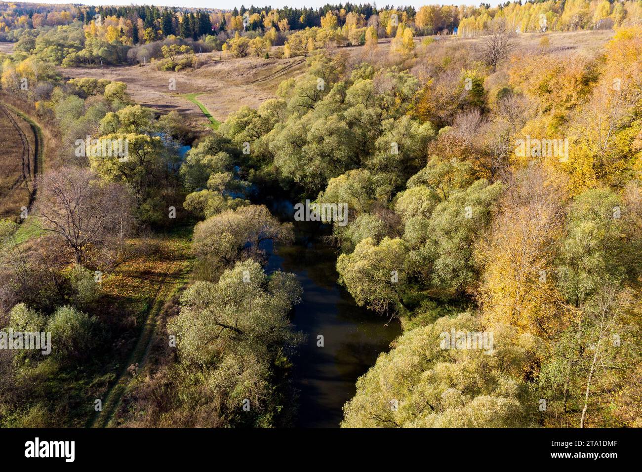 Autumn landscape from a height overlooking a river bed surrounded by ...