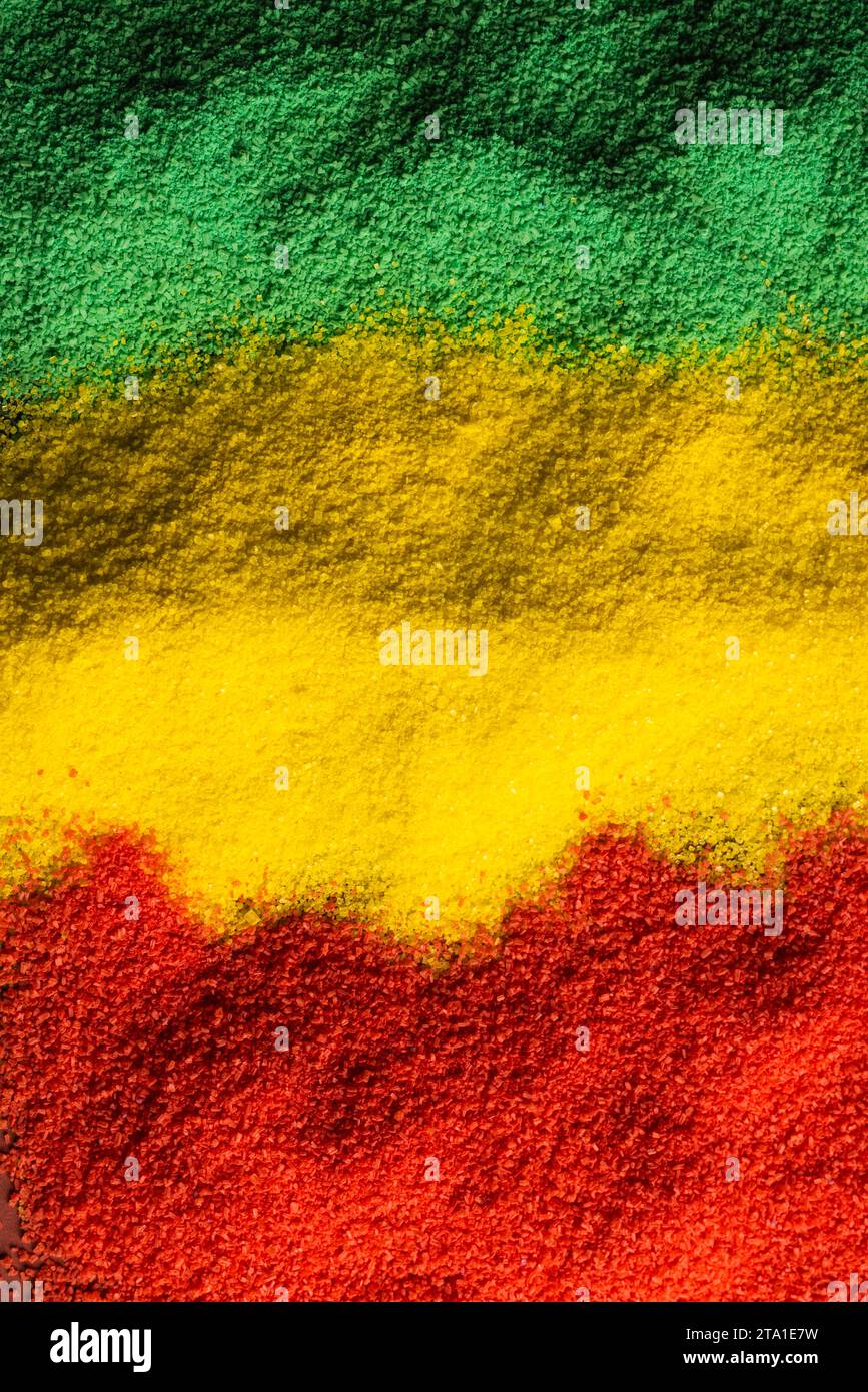 Vertical image of green, yellow and red powders with copy space ...