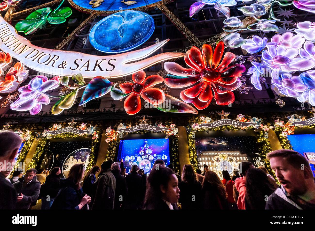Thousands of visitors crowd Saks Fifth Avenue in New York to view their ...