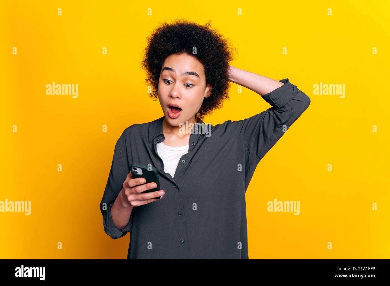 Shocked surprised african american or brazilian young woman with short ...